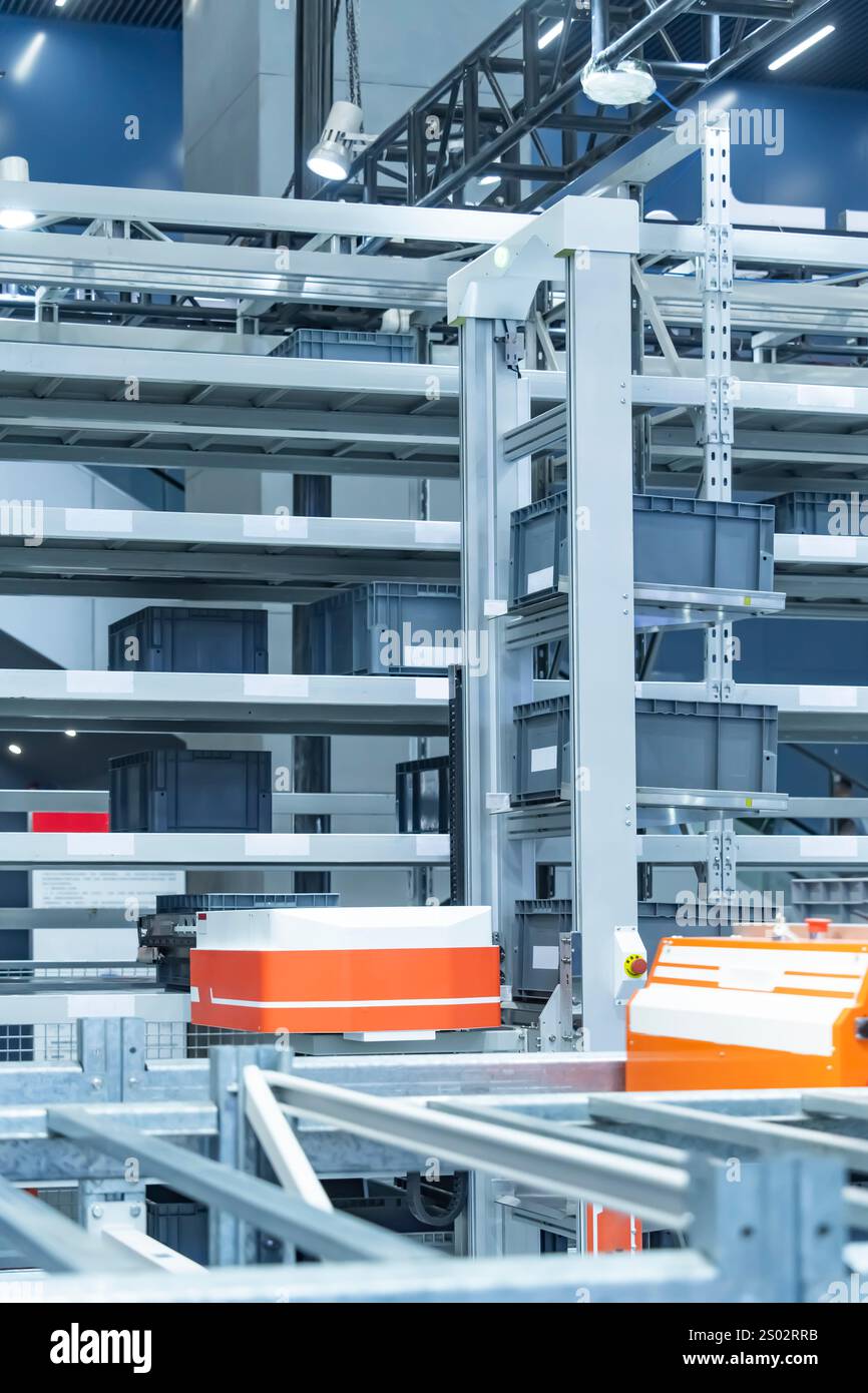 Automation in the warehouse controls a robot loader Robots sort and move boxes Stock Photo - Alamy