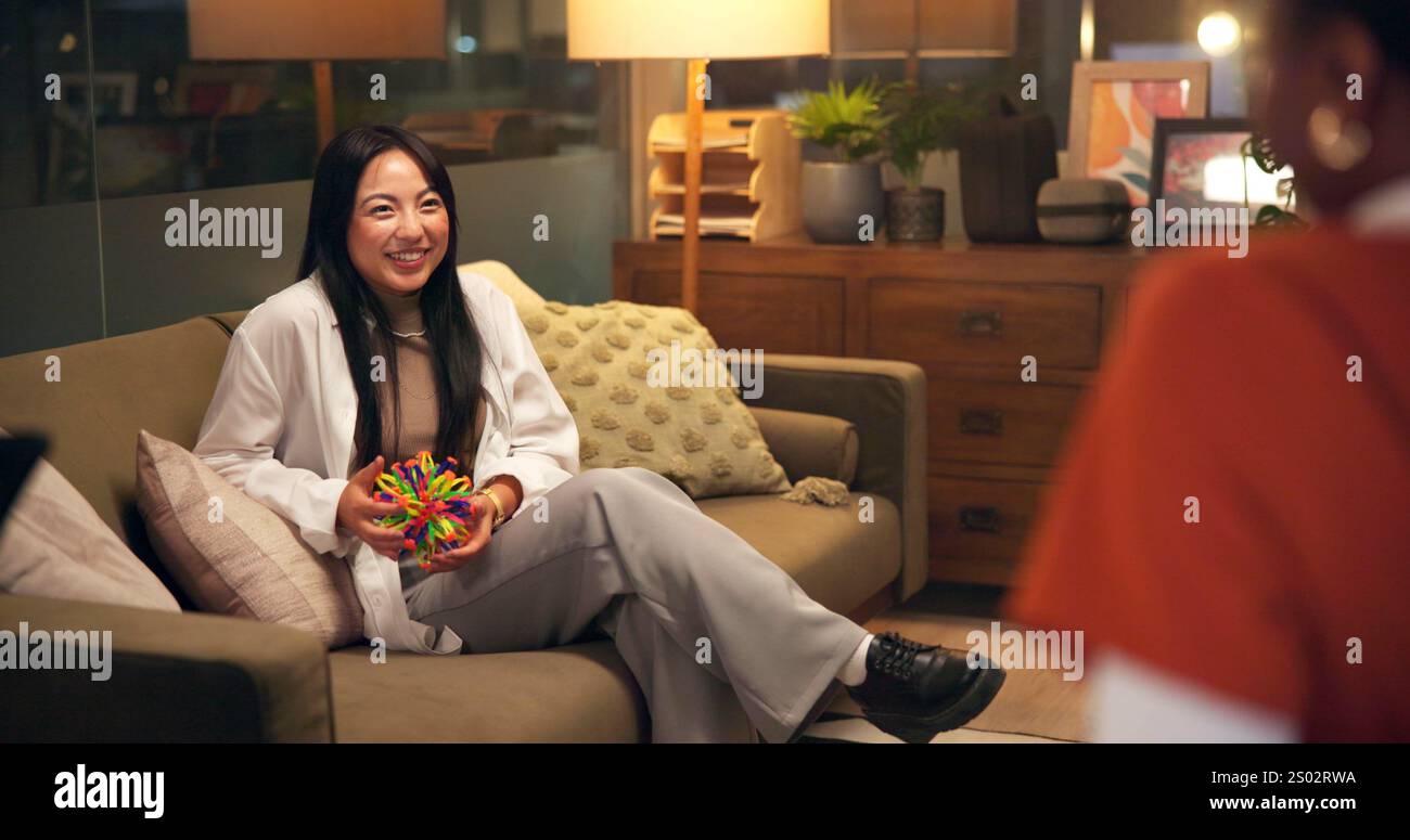 Smile, asian woman and consulting with sofa for communication ...