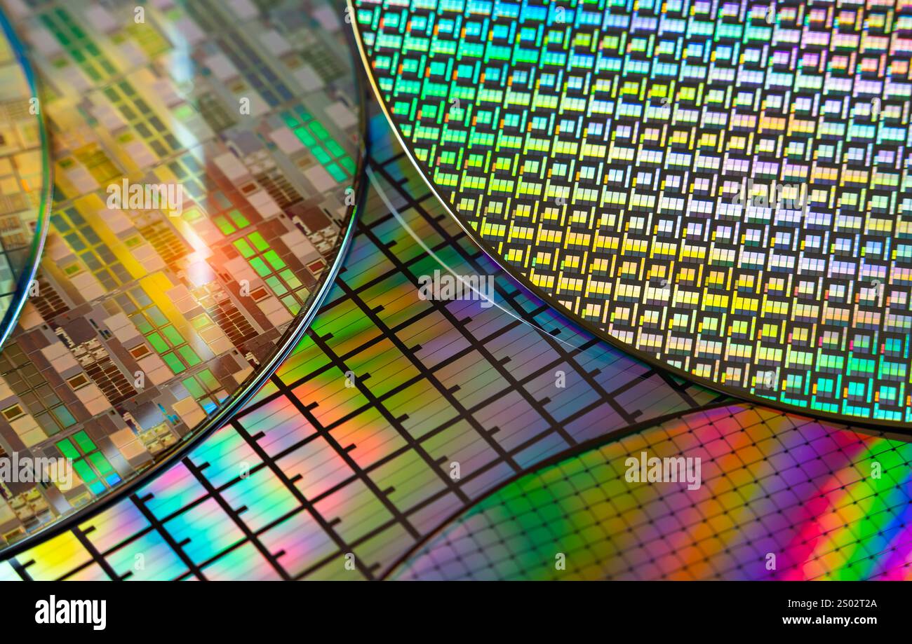 Silicon Wafers with microchips used in electronics for the fabrication of integrated circuits ...