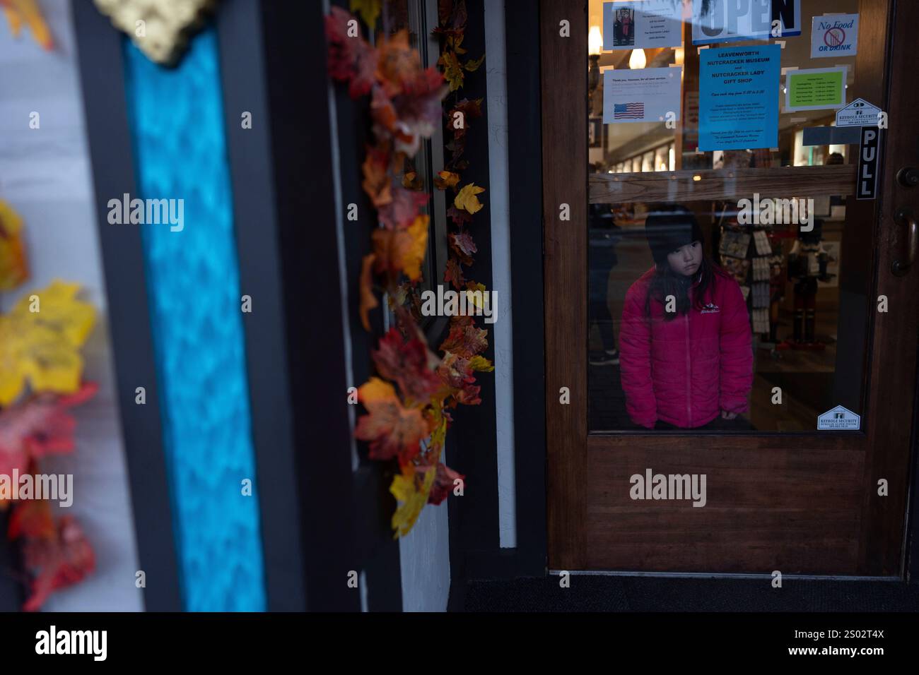 Erica Irwin, 6, looks out the door as she waits for her sister at the ...