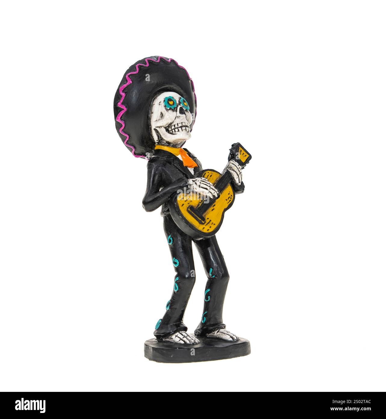 Skeleton character in costume for Day of the Dead dancing and playing ...