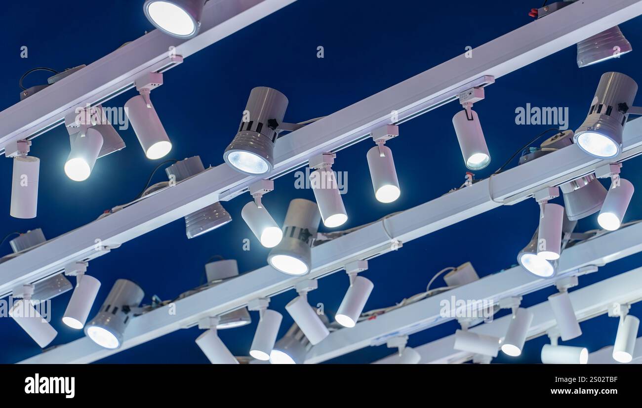 Directional LED lights on rails under the ceiling Stock Photo - Alamy