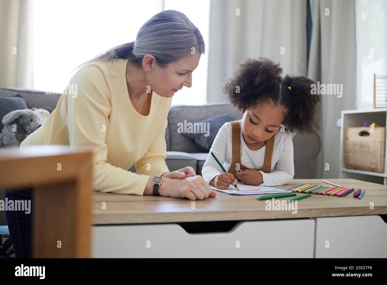 Therapist, child and education with drawing for development, learning ...