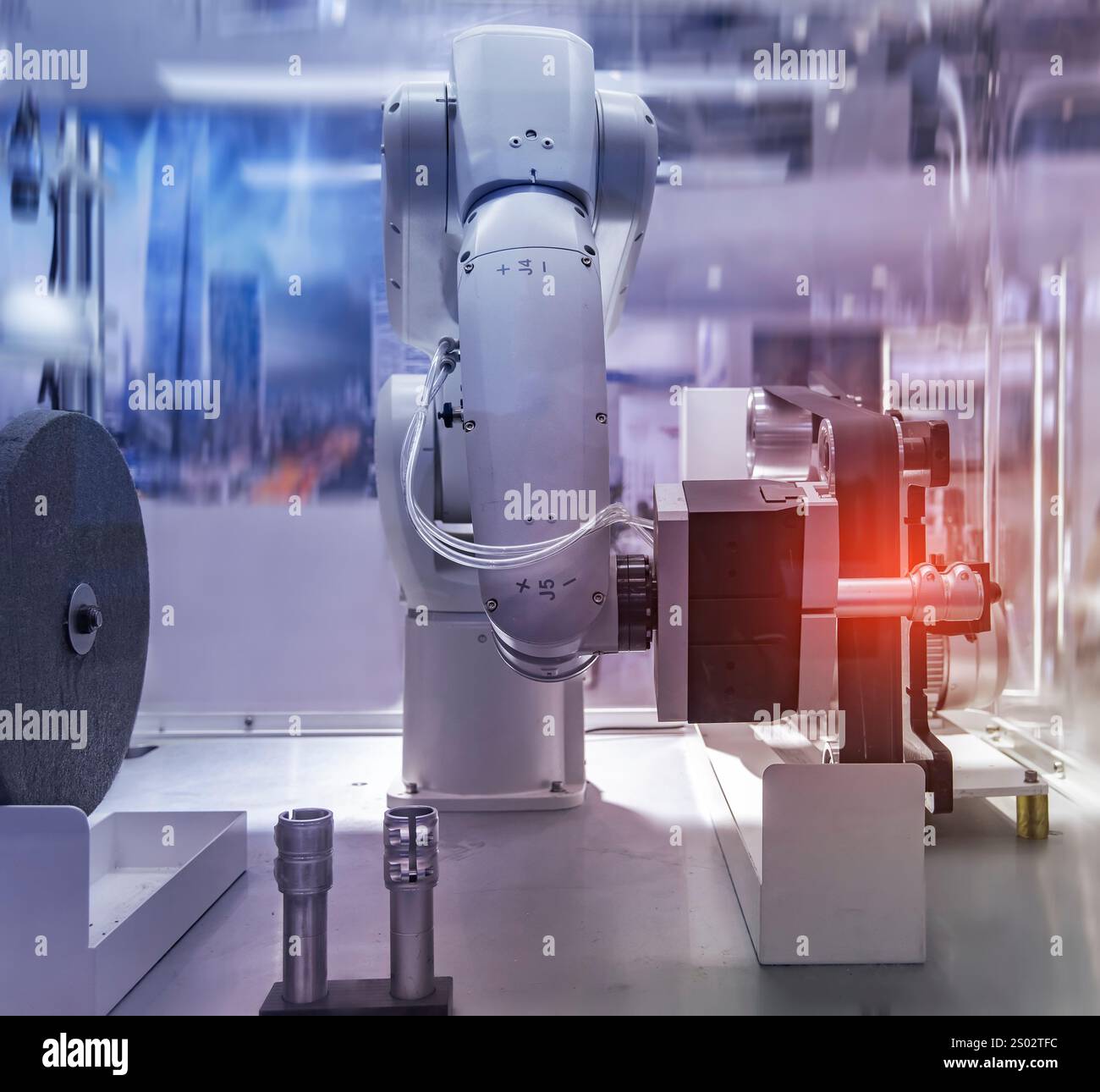 automatic arm handling the metal machined shaft parts polishing between ...