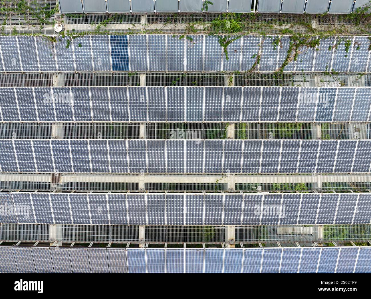 Aerial view directly above Solar panels on the roof of a shopping mall ...