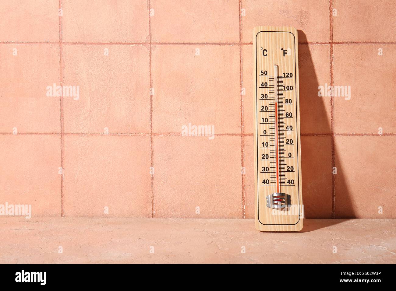 Weather thermometer on table against color tile background Stock Photo ...