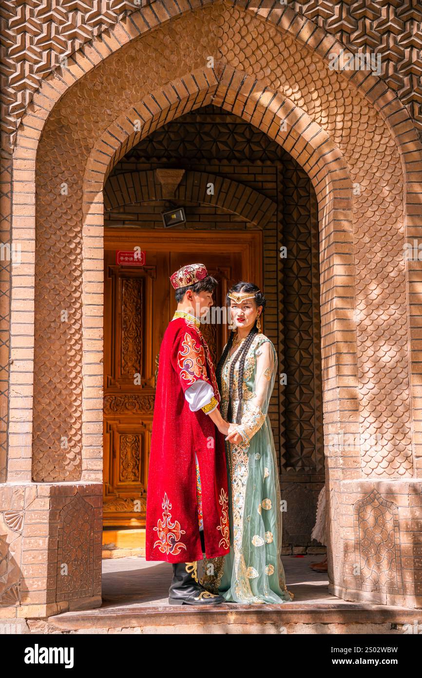 Kashgar, Xinjiang, China - JULY, 17, 2023: A couple wearing traditional ...