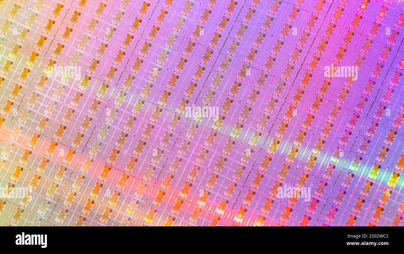 silicon chip wafer reflecting different colors Stock Photo - Alamy