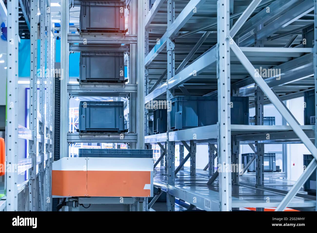 plastic boxes in the cells of the automated warehouse. Metal ...