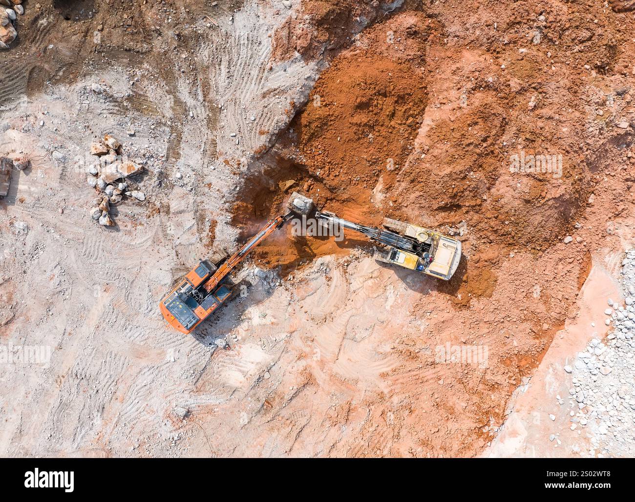 Excavator on earthmoving at construction site, aerial view Stock Photo ...