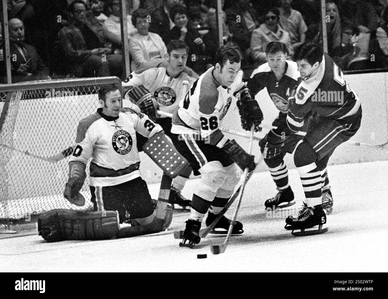 Pittsburgh Penguins goalie Les Binkley (30) with help from Syl Apps (26 ...