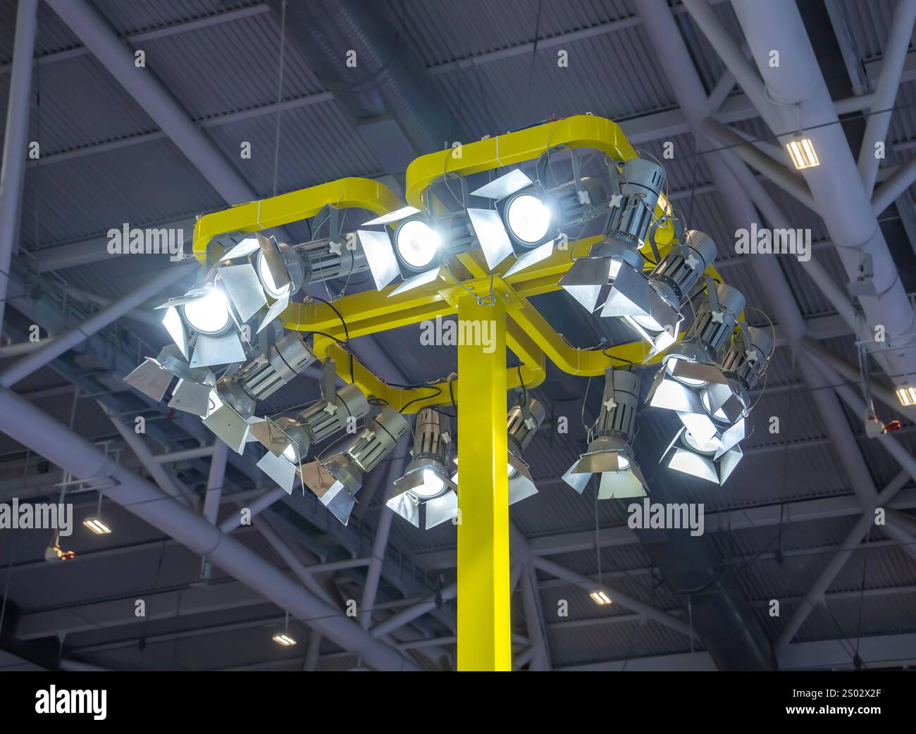 bright halogen spotlights on exhibition ceiling. industrial building ...