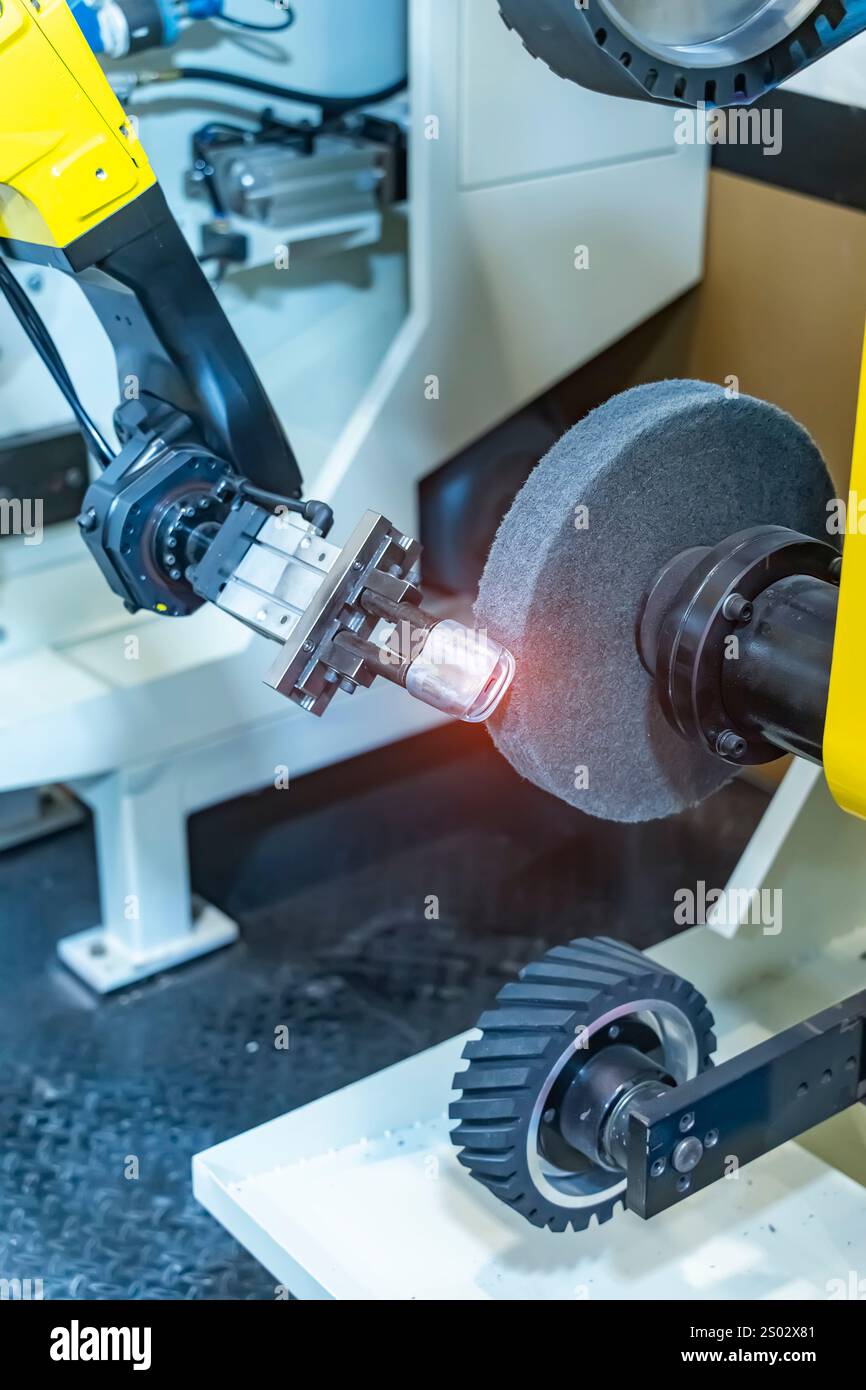 robotic arm handling the metal machined shaft parts polishing between ...