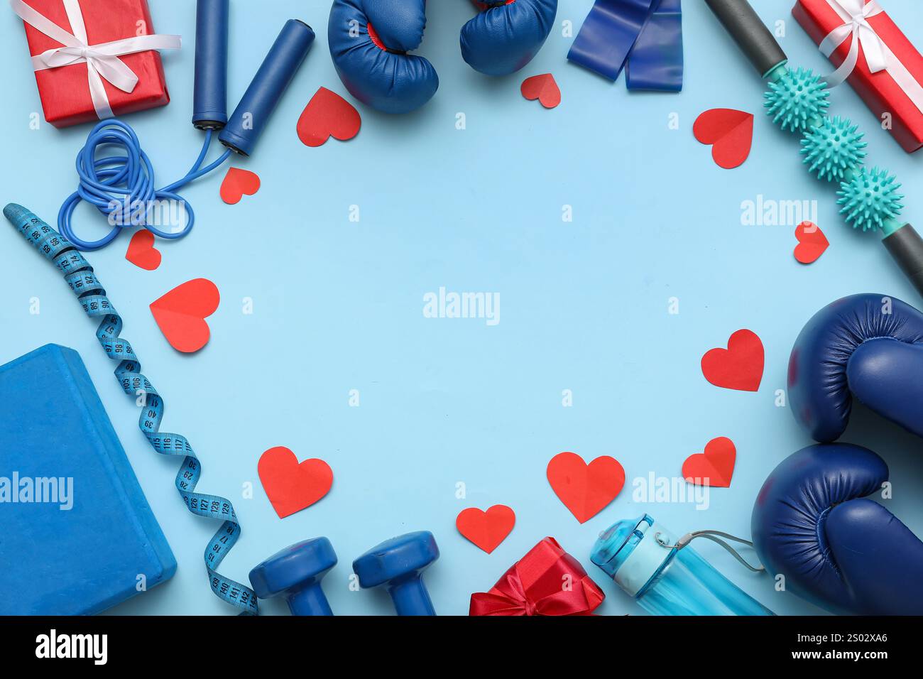 Frame made of different sports equipment, gifts and red paper hearts on ...