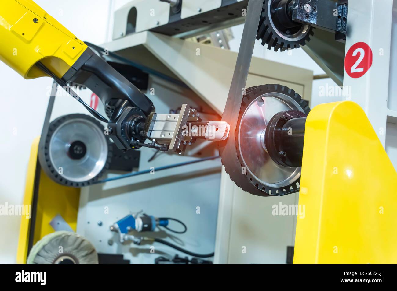robotic arm handling the metal machined shaft parts polishing between ...