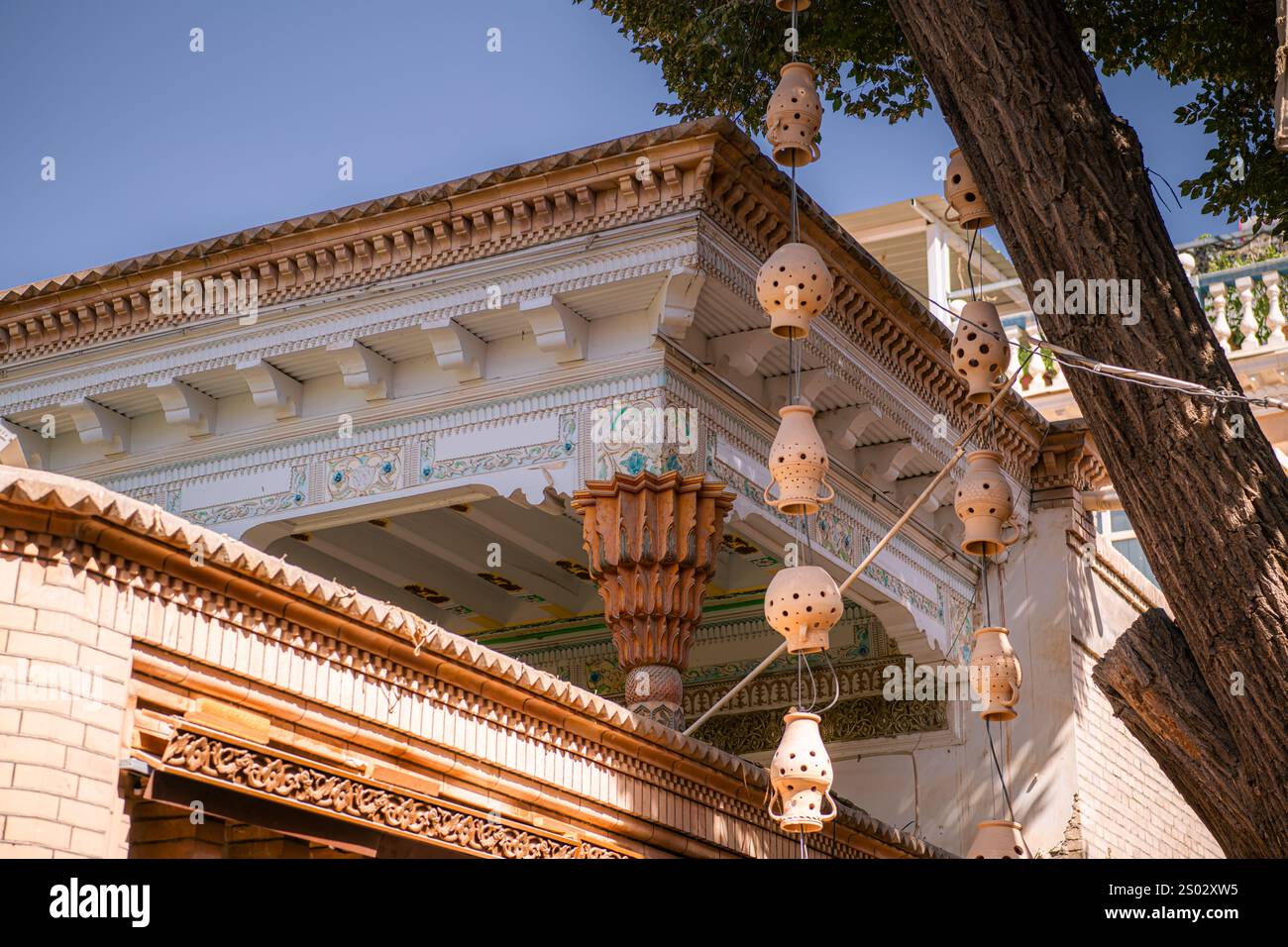 Kashgar, Xinjiang, China - JULY, 17, 2023: Uighur girl walking along ...