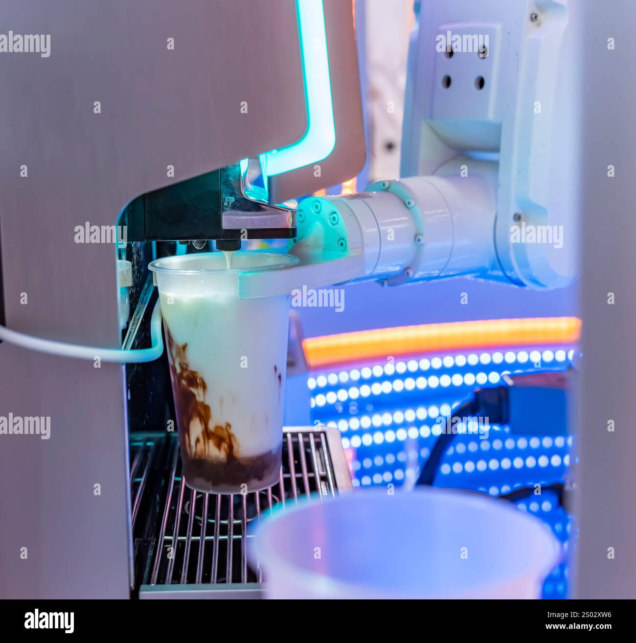 automatic robot arm preparing coffee with coffee machine Stock Photo ...
