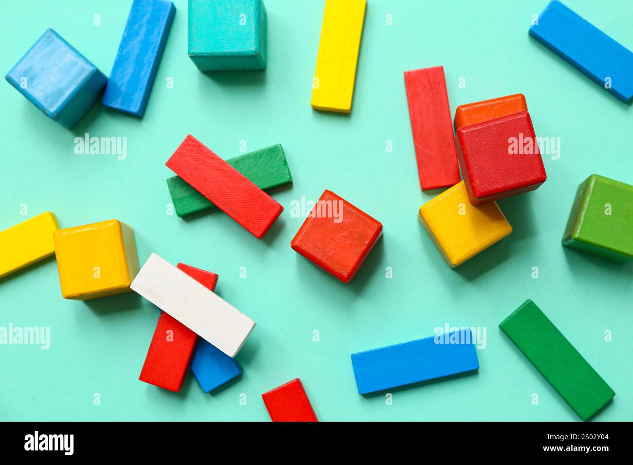 Colorful building cubes and blocks on turquoise background Stock Photo ...