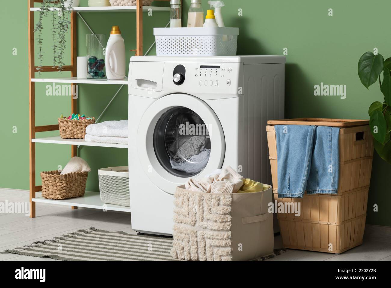 Washing machine with baskets in modern laundry room Stock Photo - Alamy
