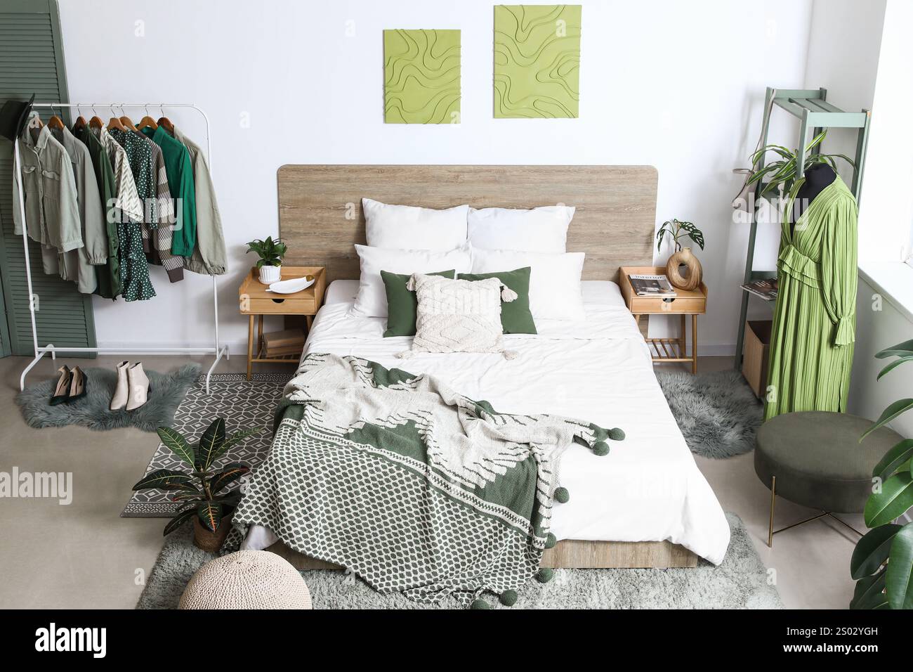 Interior of stylish bedroom with clothes rack and mannequin Stock Photo ...