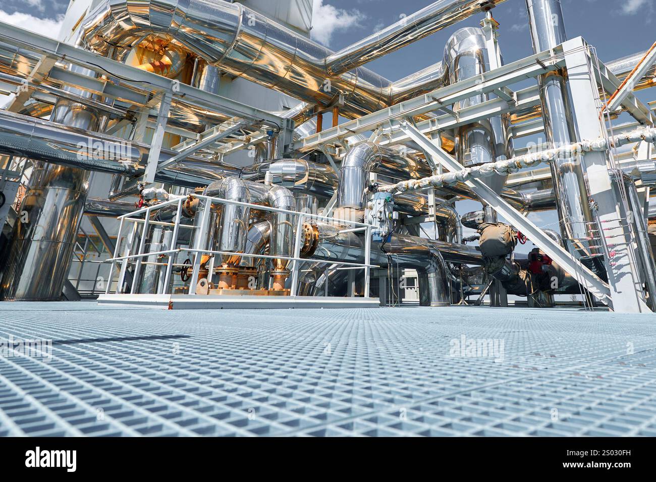 Vast network of stainless steel pipelines at a chemical plant during ...