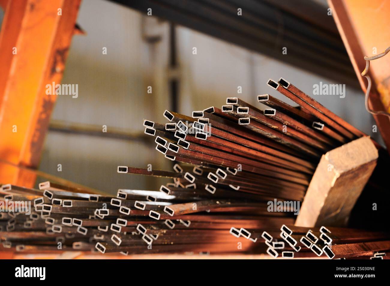 Rectangle heat tubing on rack in cold factory warehouse Stock Photo - Alamy