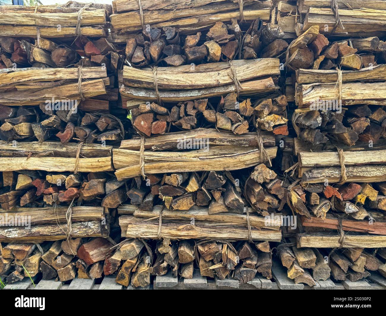 Stacked Firewood Bundles - Rustic Natural Energy Source Stock Photo - Alamy