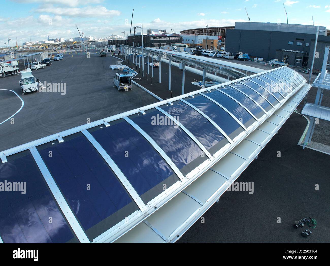 Perovskite solar cells are installed on the roof of the bus stop at the ...