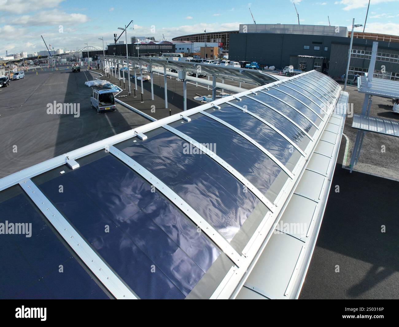 Perovskite solar cells are installed on the roof of the bus stop at the ...
