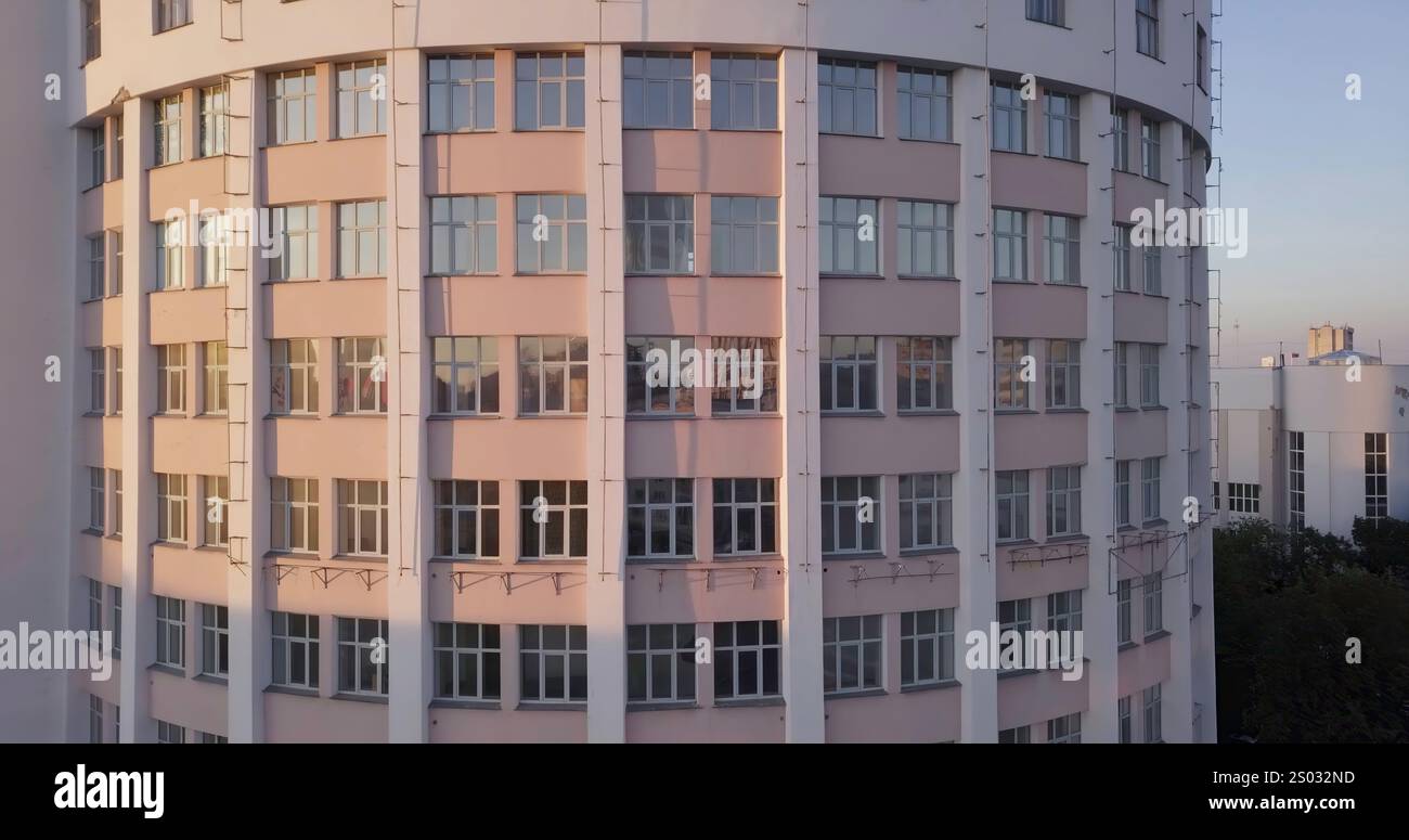 A Modern Round Building featuring Glass Windows beautifully situated at ...