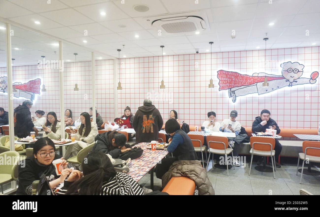 People have lunch at a KFC outlet in Hangzhou in east China's Zhejiang ...
