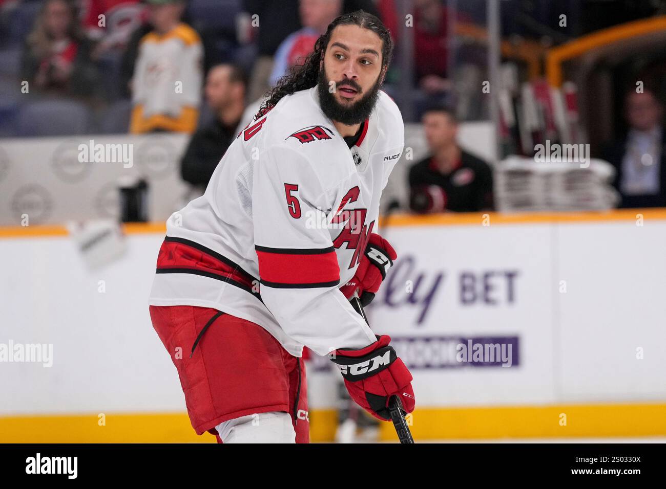 Carolina Hurricanes defenseman Jalen Chatfield (5) warms up for the ...