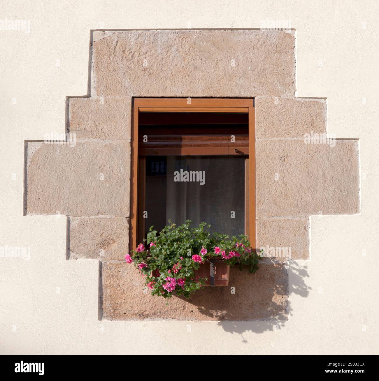 A rustic building features a wooden window with open shutters and a ...