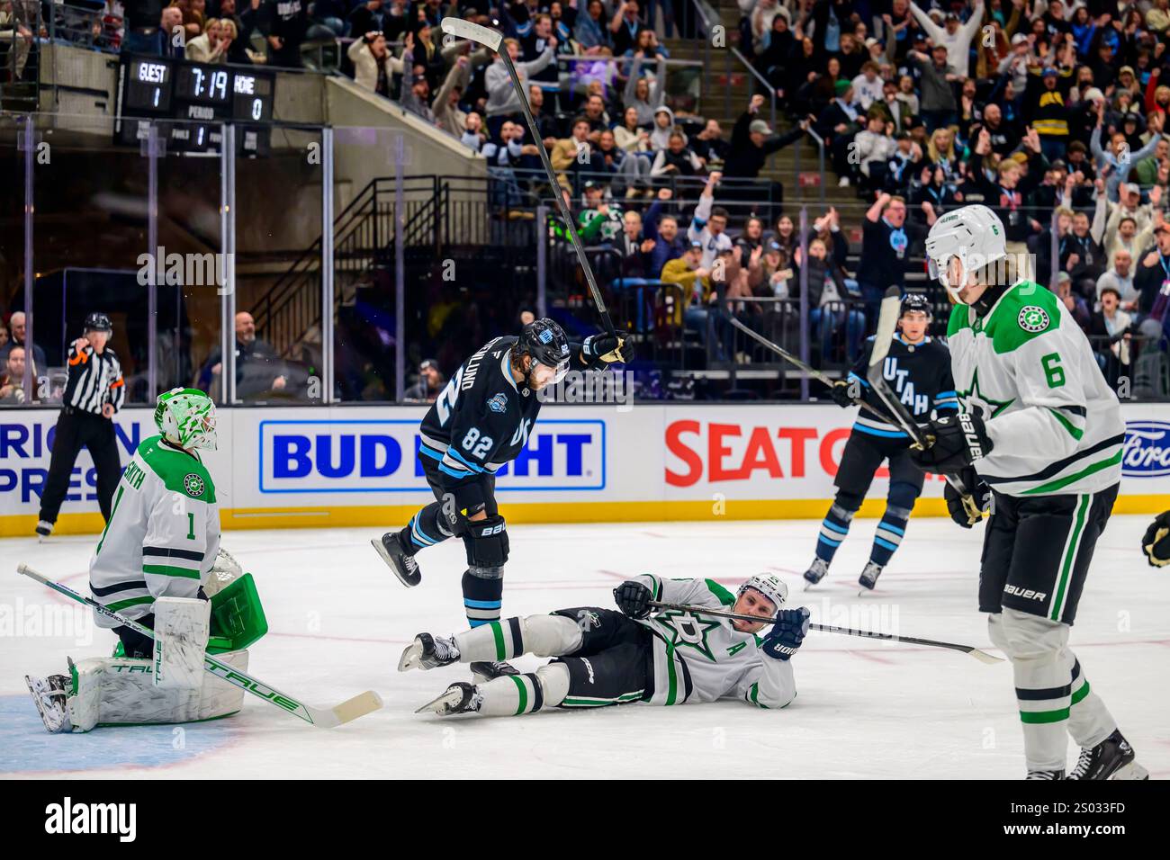 Utah Hockey Club center Kevin Stenlund (82) raises his stick in ...