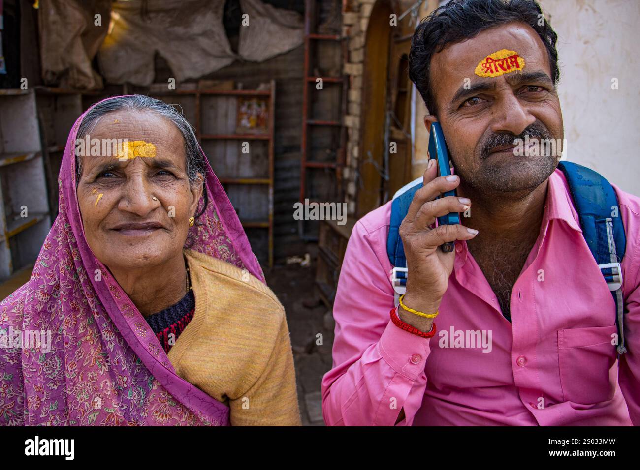 Pilgrims in colourful clothes and ram-tilaka (forehead marking) on the ...