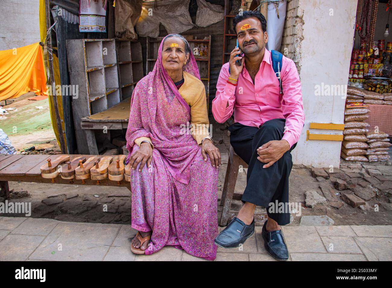 Pilgrims in colourful clothes and ram-tilaka (forehead marking) on the ...
