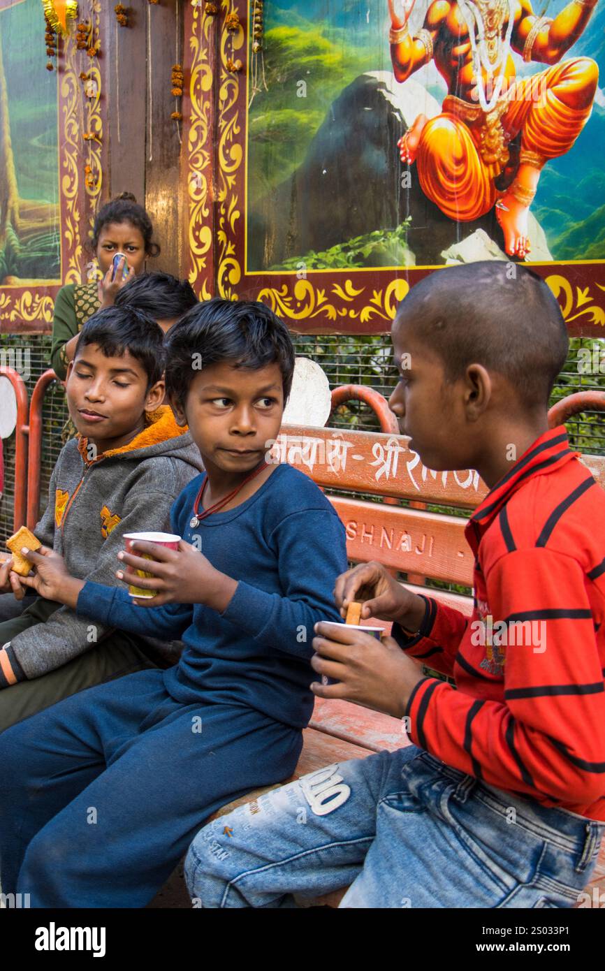 Children enjoying halwa snacks distributed by Varanasi temple associate ...