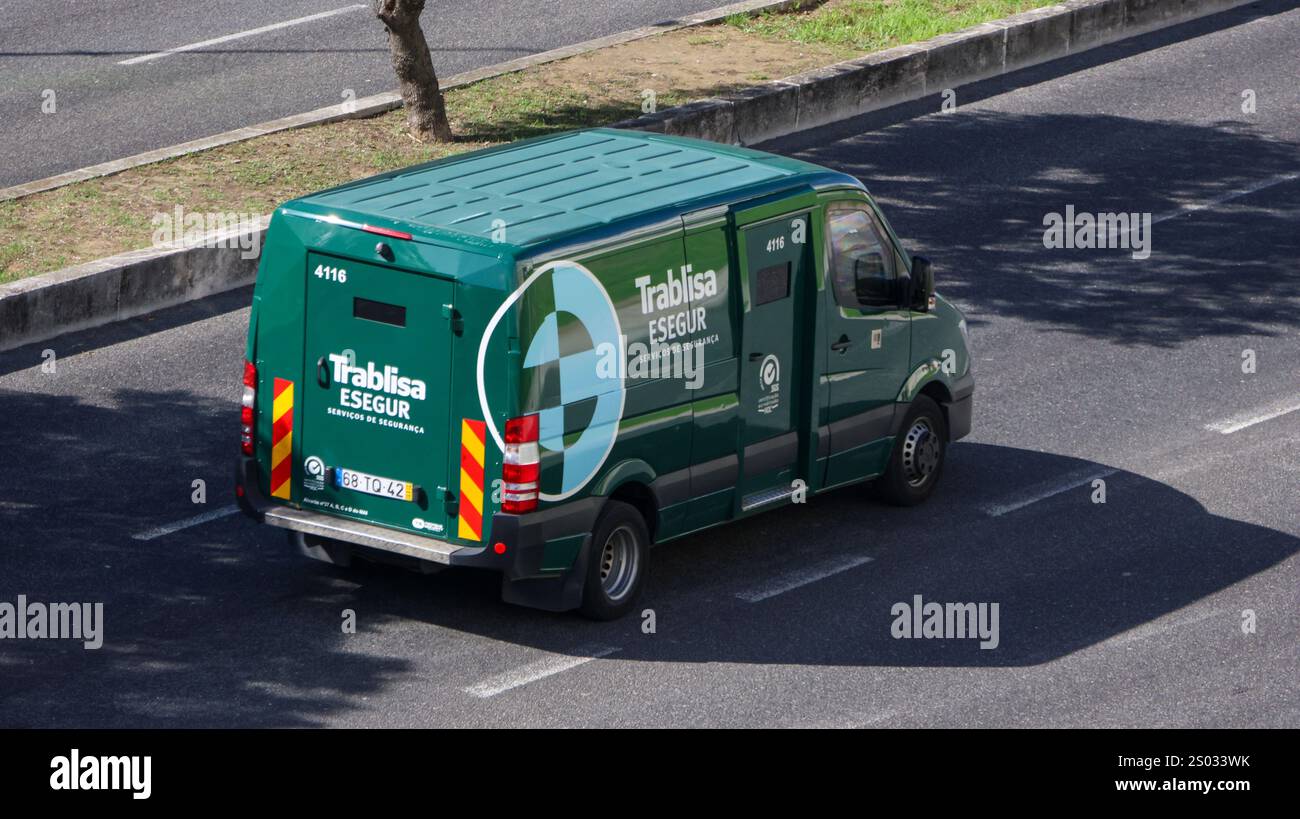 Trablisa security van driving on road, delivering cash and valuables ...