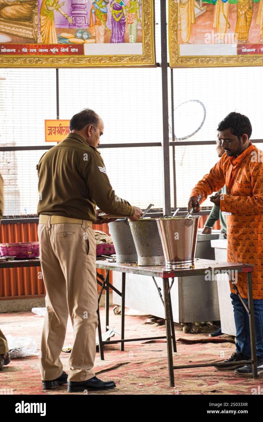 Pilgrims eating at a dining of Panchavati facility, Karsevak Puram in ...