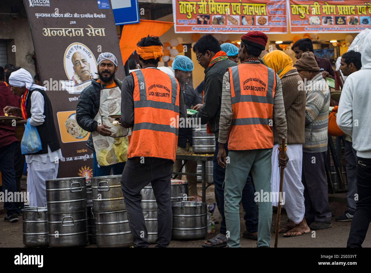Pilgrims queued for complementary food distributed by ISKON. Ram ...