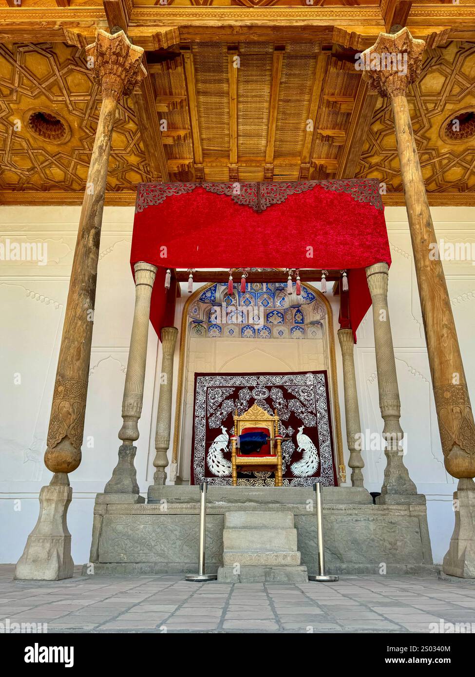 Ornate Golden Throne with Carved Wooden Columns in a Historical ...