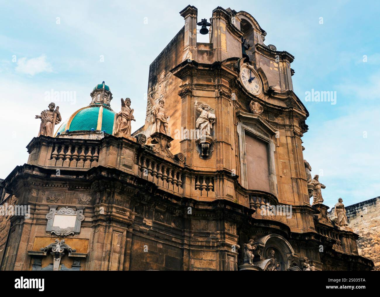 A historic building featuring ornate architecture with statues and a ...