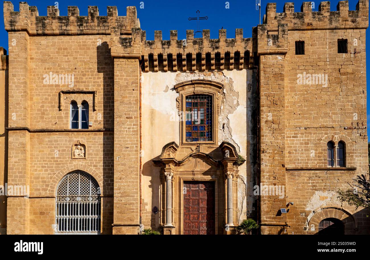 A historic stone castle with a large wooden door and decorative stained ...