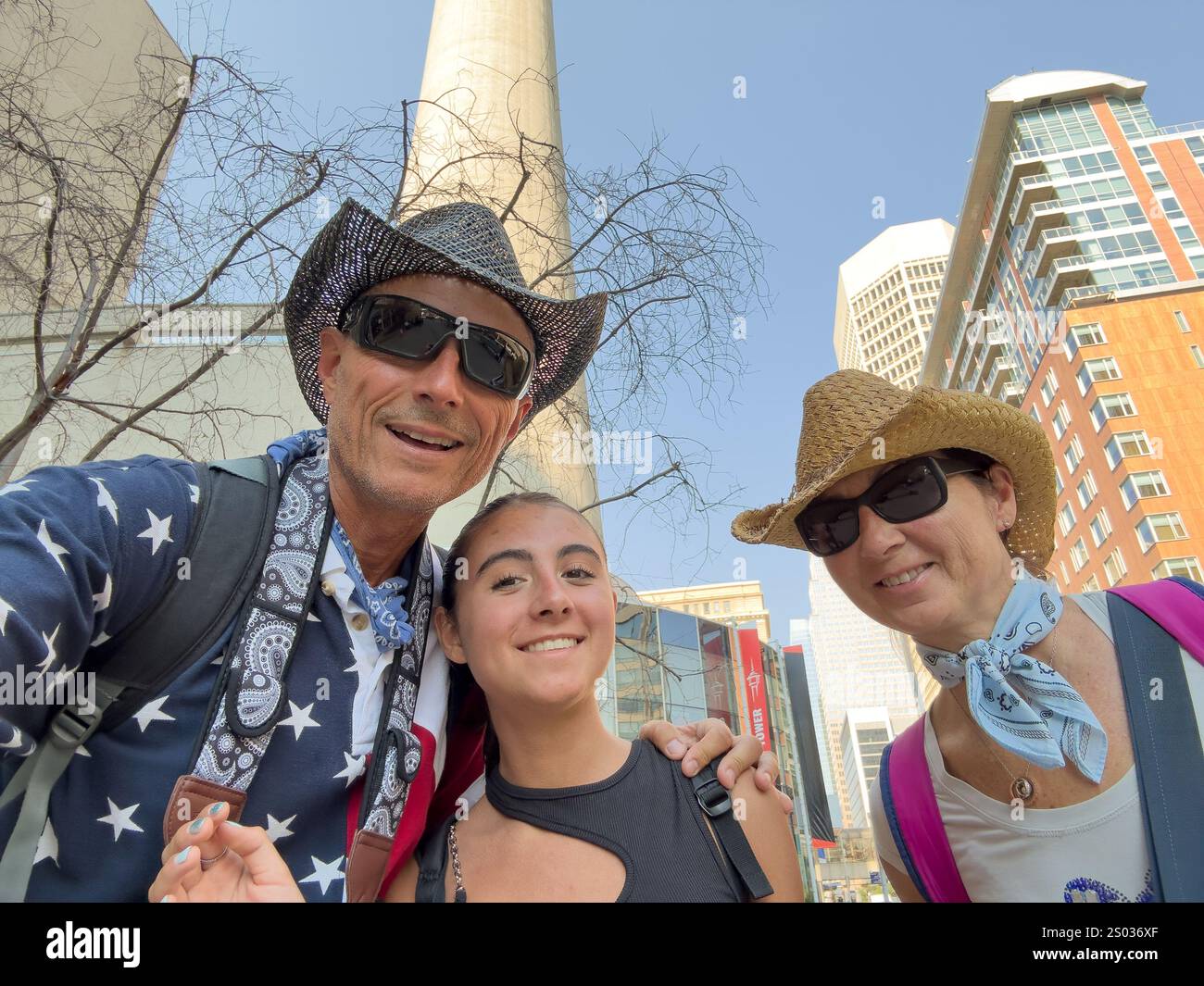 Happy family wearing straw hat during Calgary Stampede Stock Photo - Alamy