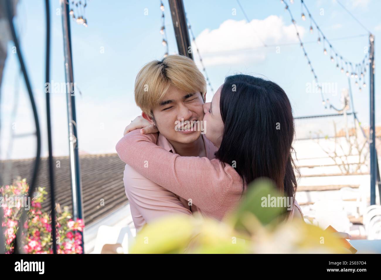 Couple embracing on a rooftop valentine day celebration romantic ...