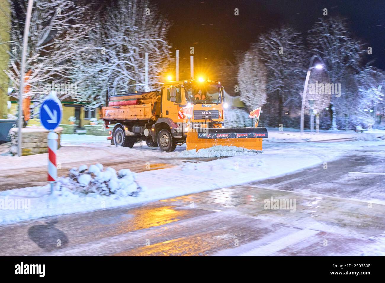 Cars and street covered by snow and snow plows try to combat the heavy ...