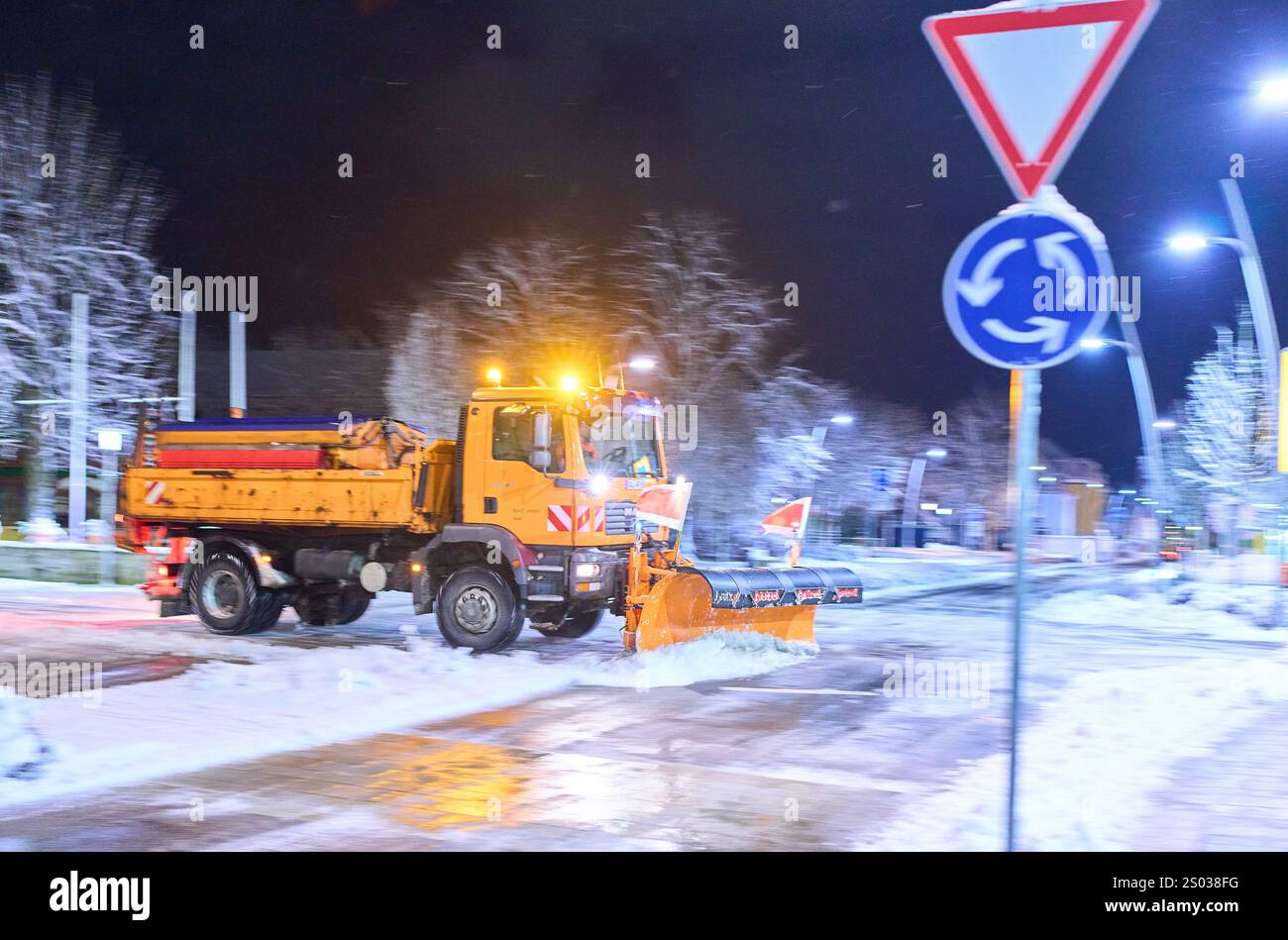 Cars and street covered by snow and snow plows try to combat the heavy ...