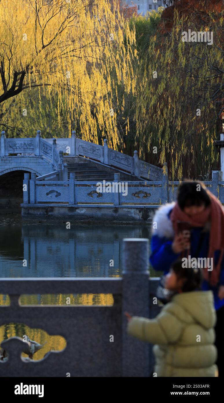 Tourists enjoy winter time at a park in Huai'an City, east China's ...