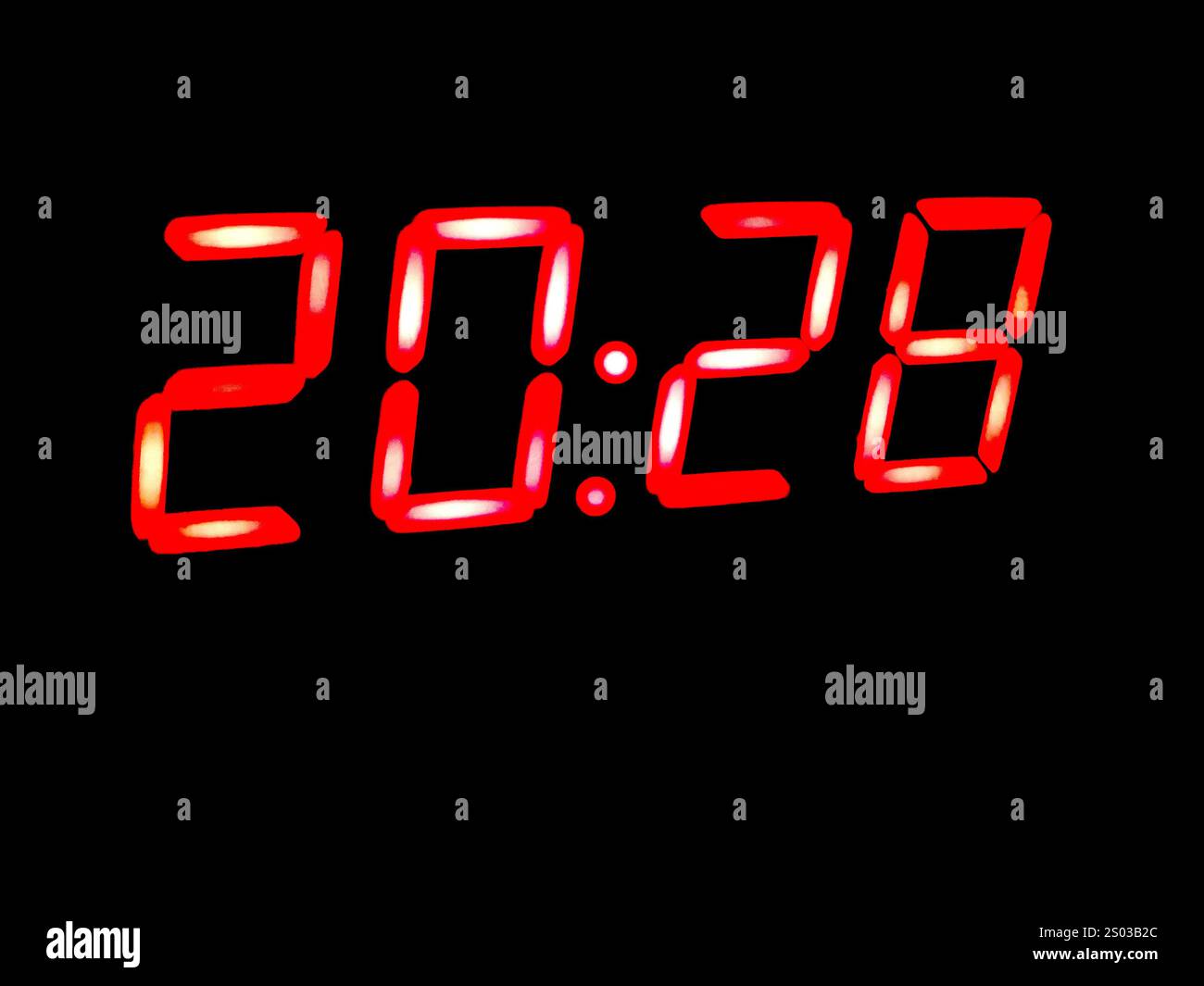 A digital clock face showing the time in red numbers on a black ...