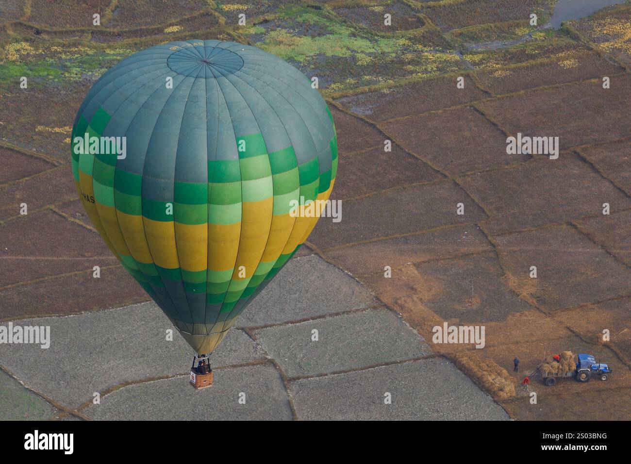 Pokhara, Nepal. 24th Dec, 2024. A hot air balloon soars above the ...
